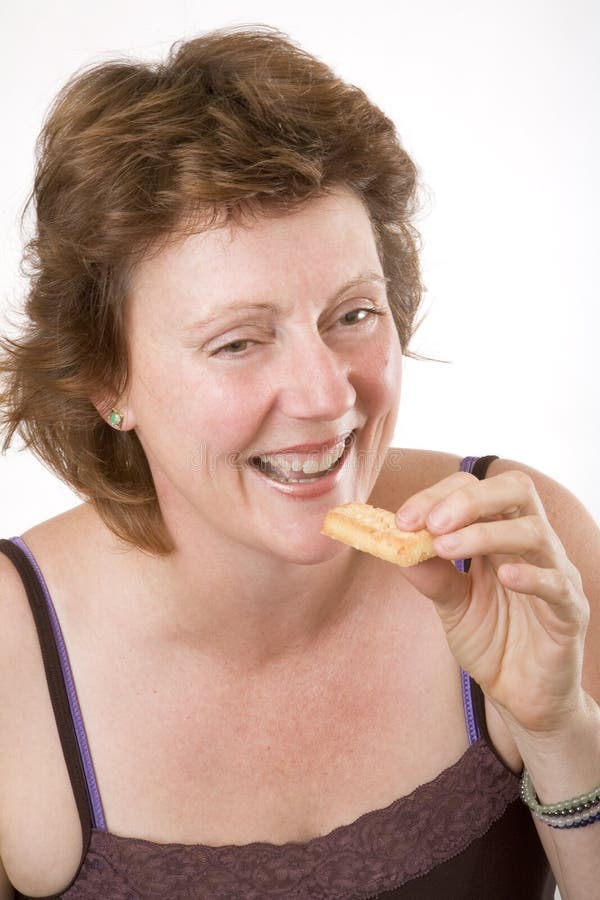 Eating a biscuit stock image. Image of female, laughing - 913531
