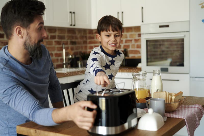 Eating breakfast with dad stock image. Image of lifestyle - 224197101