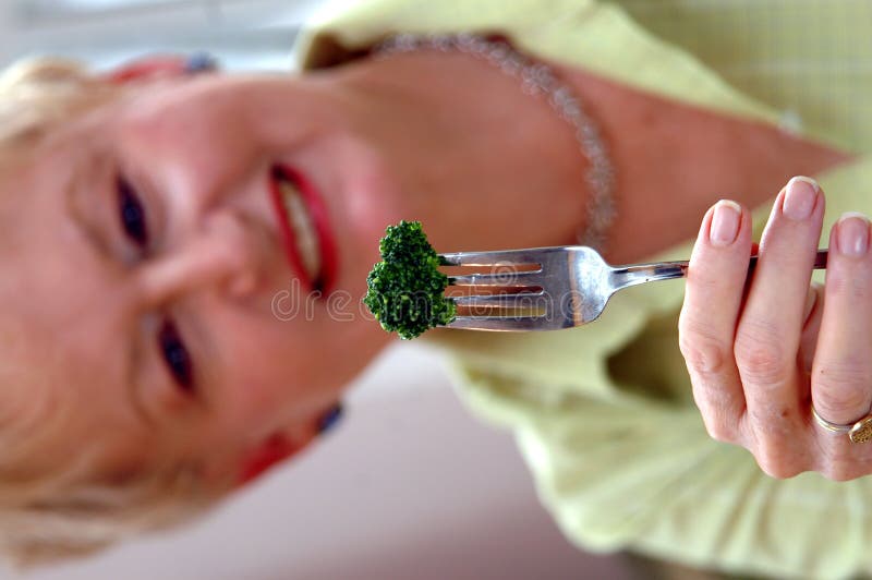 Eating broccoli stock photo. Image of healthy, broccoli - 1793566
