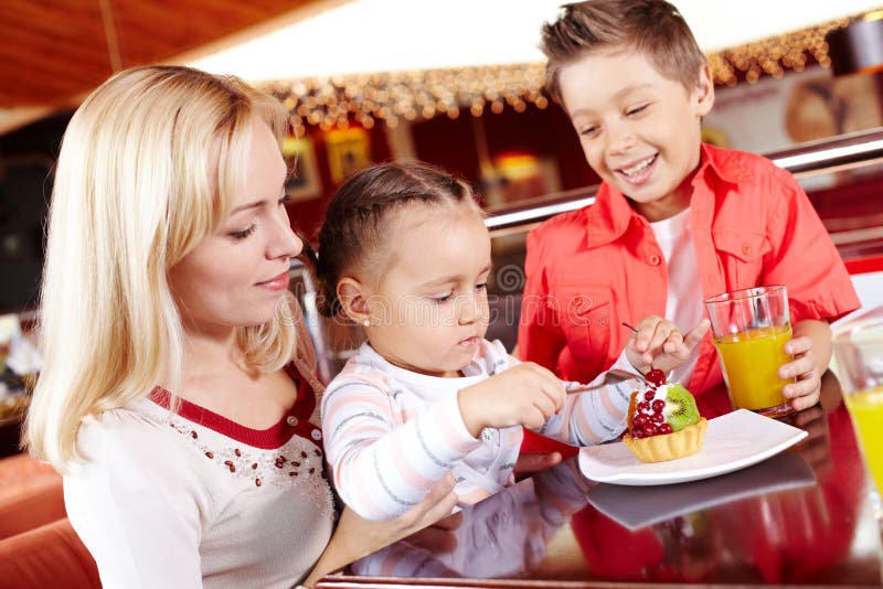 Eating in cafe stock image. Image of mother, juice, cupcake - 21347469