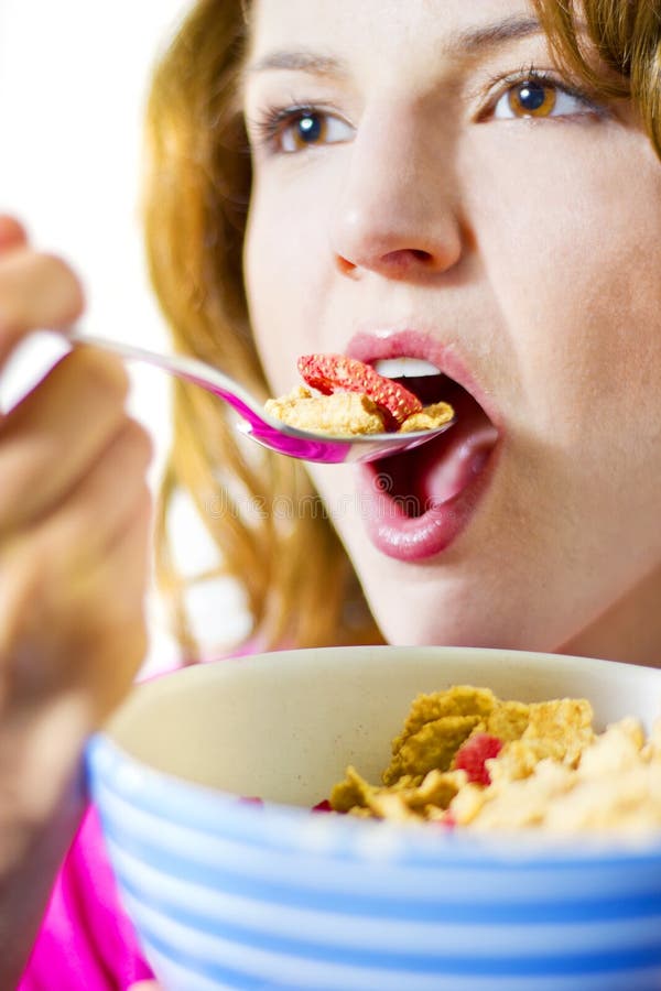 Eating Cereal stock image. Image of flakes, background - 24598175