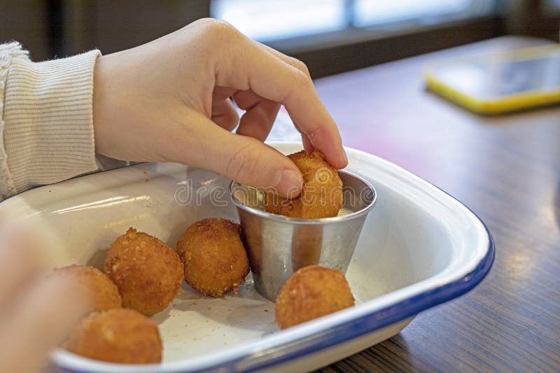 Eating Cheese Balls with Garlic Sauce Stock Image - Image of experience ...