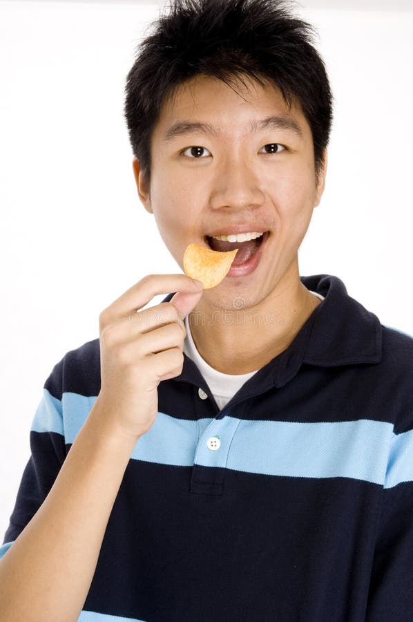 Eating Chips stock photo. Image of expression, background - 768888
