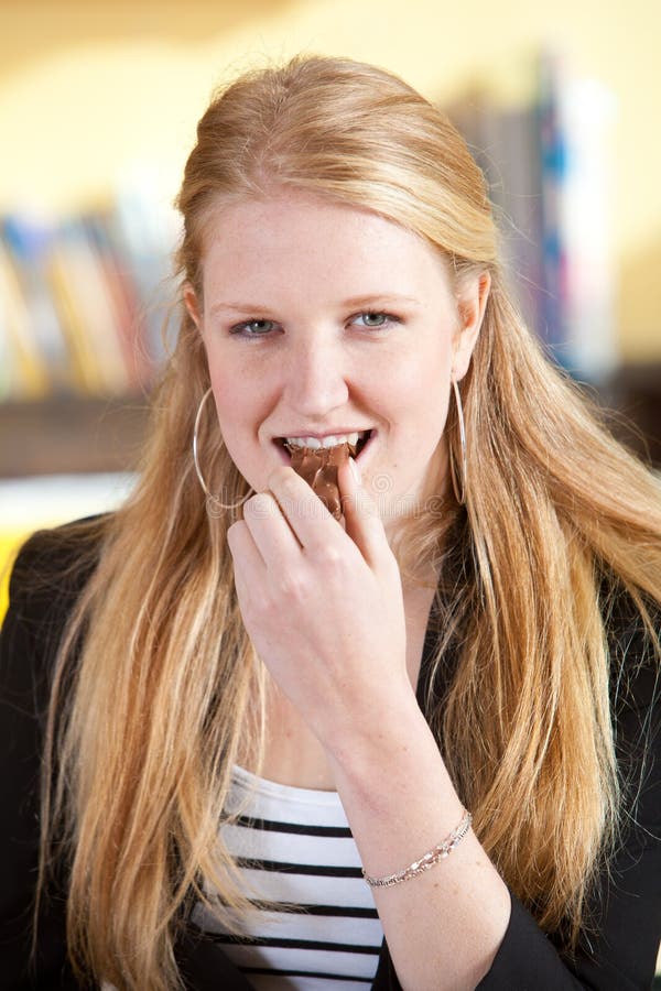 Eating chocolate stock photo. Image of student, junkfood - 17522756