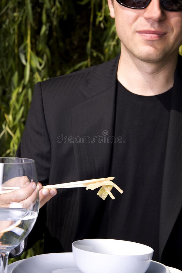 Eating with chop sticks stock photo. Image of food, eating - 10473810