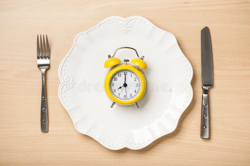 Eating Concept with Tableware and Alarm Clock Stock Photo - Image of ...