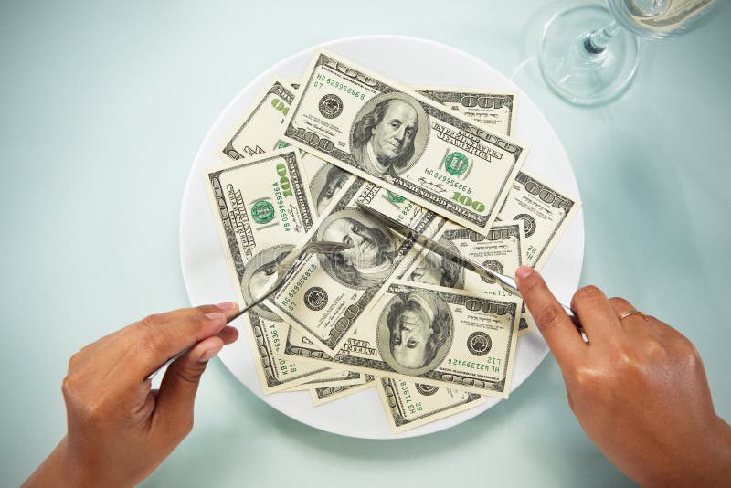 Eating the dollar bills stock image. Image of financial - 20481883