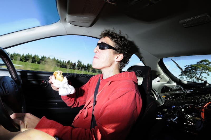 Eating and driving stock image. Image of steering, wheel - 8403553