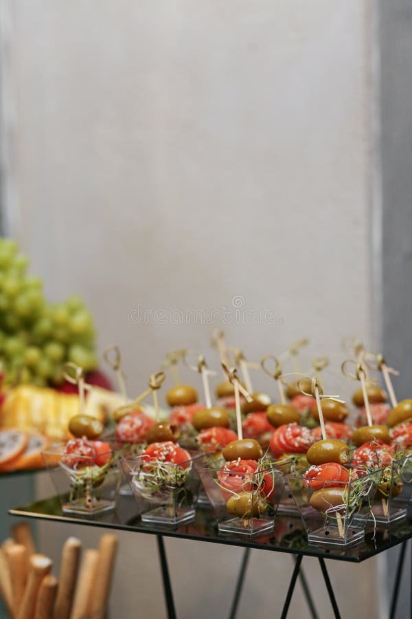 Eating at the Event. Disposable Plastic Cups with Snacks - Salmon with ...