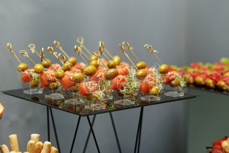 Eating at the Event. Disposable Plastic Cups with Snacks - Salmon with ...