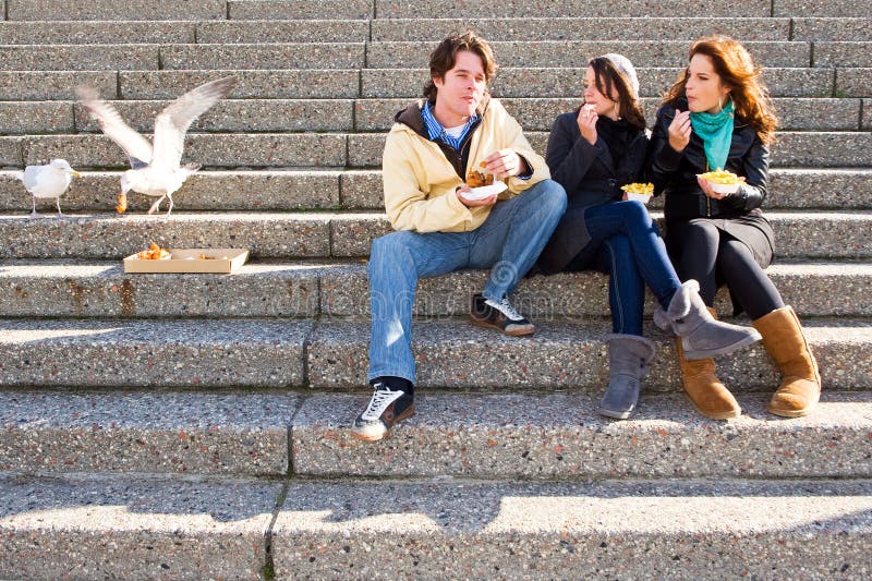 Boy eating Fish in Harbour stock image. Image of young - 6427877