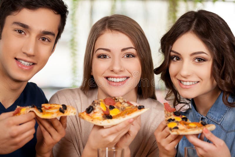 Eating a fresh pizza. stock image. Image of adult, casual - 37148727