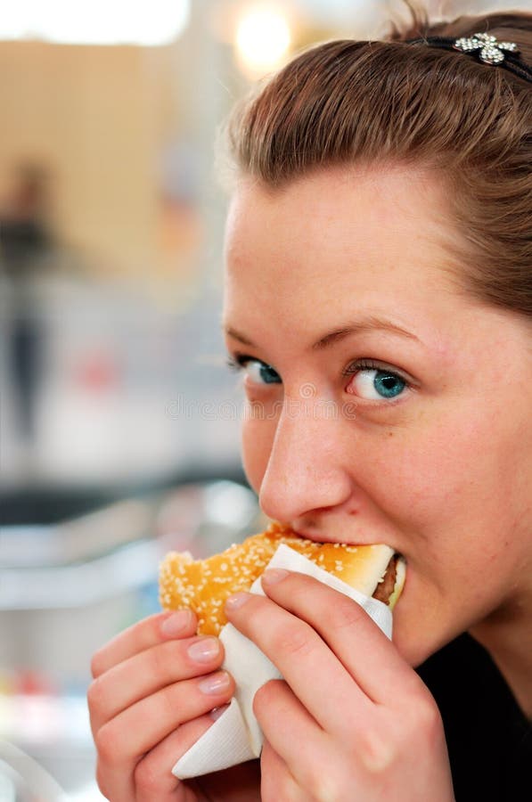 Eating hamburger stock image. Image of hamburger, hand - 11011183