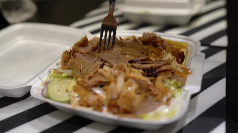 Eating Kebab with fork stock video. Video of dish, plastic - 268641101