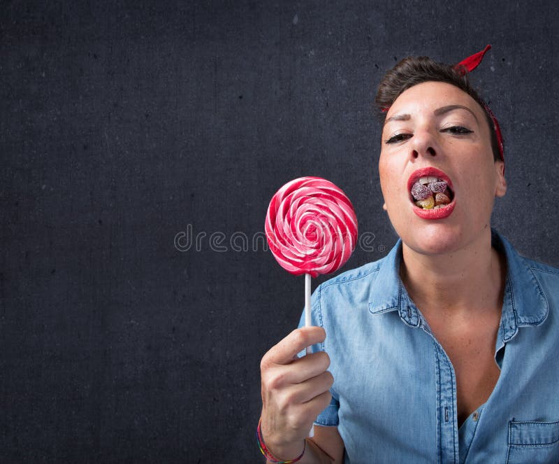 Eating a lot of candy stock photo. Image of unhealthy - 50336310