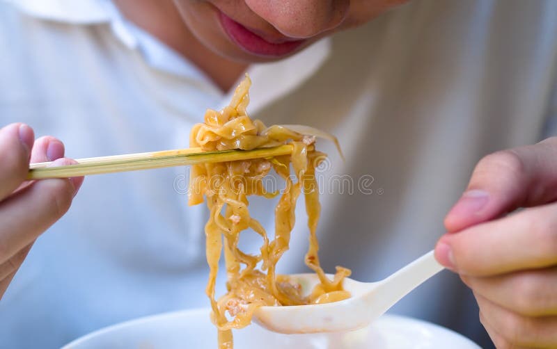 Eating Noodles stock image. Image of fingers, hands, common - 6165197