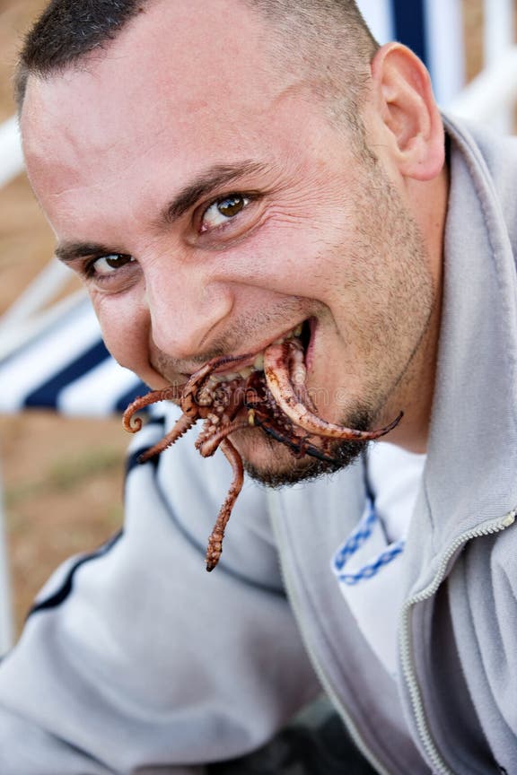 Eating the octopus stock photo. Image of devour, hair - 5741592