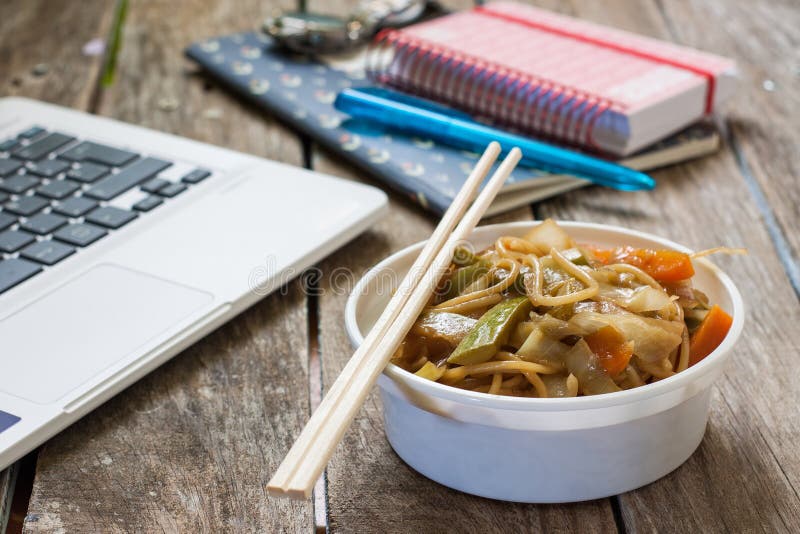 Eating at office stock image. Image of studio, chopstick - 69895637