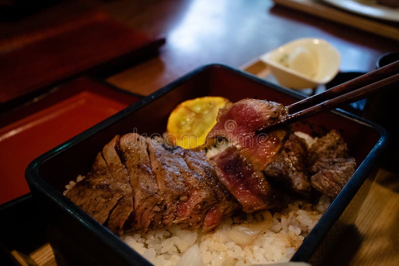 Eating Perfectly Cooked Steak in High-class Japanese Restaurant Stock ...