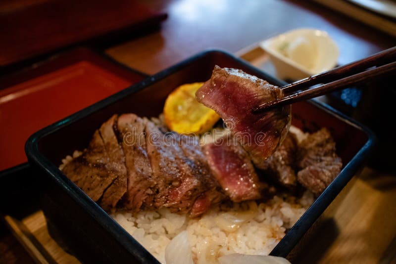 Eating Perfectly Cooked Steak in High-class Japanese Restaurant Stock ...