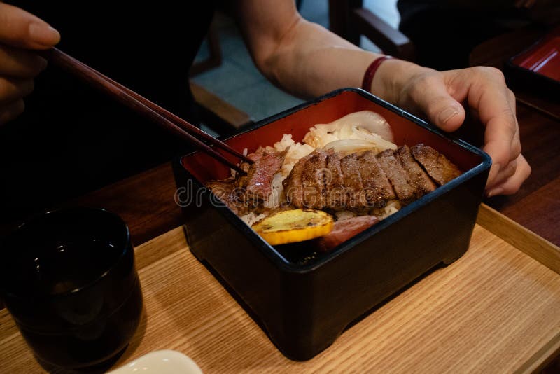 Eating Perfectly Cooked Steak in High-class Japanese Restaurant Stock ...