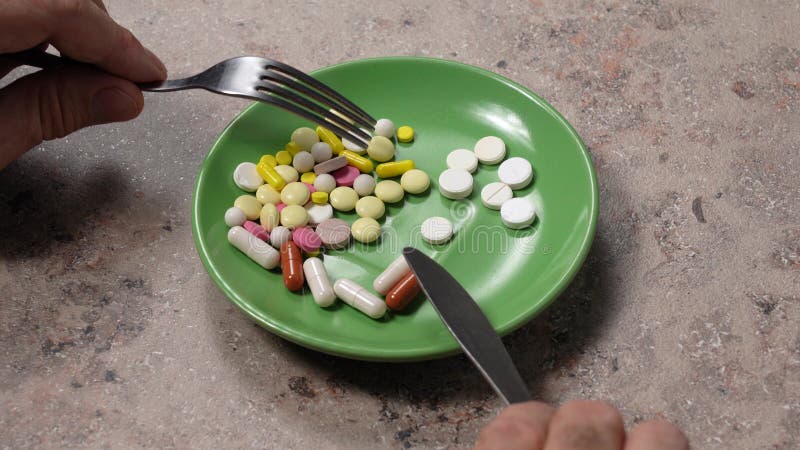 Eating Pills instead of Food. Pills on Green Plate with Fork. Pill ...