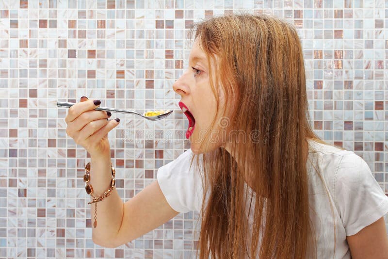 Eating pills stock photo. Image of addiction, white, female - 65661096