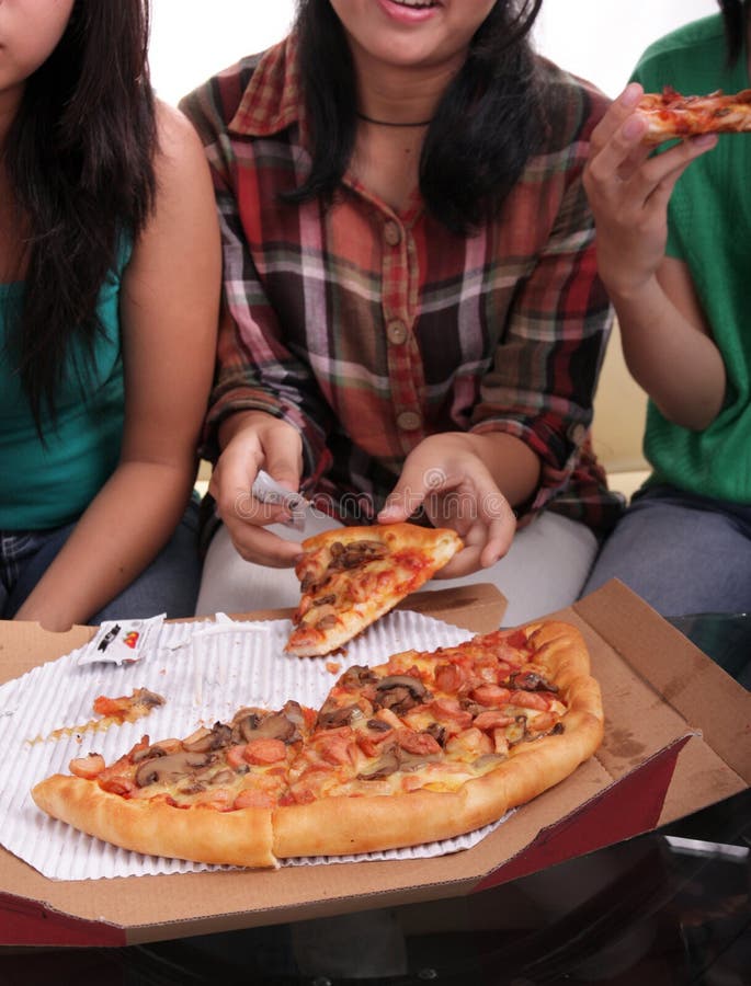 Eating pizza together stock photo. Image of meal, friendship - 9810234