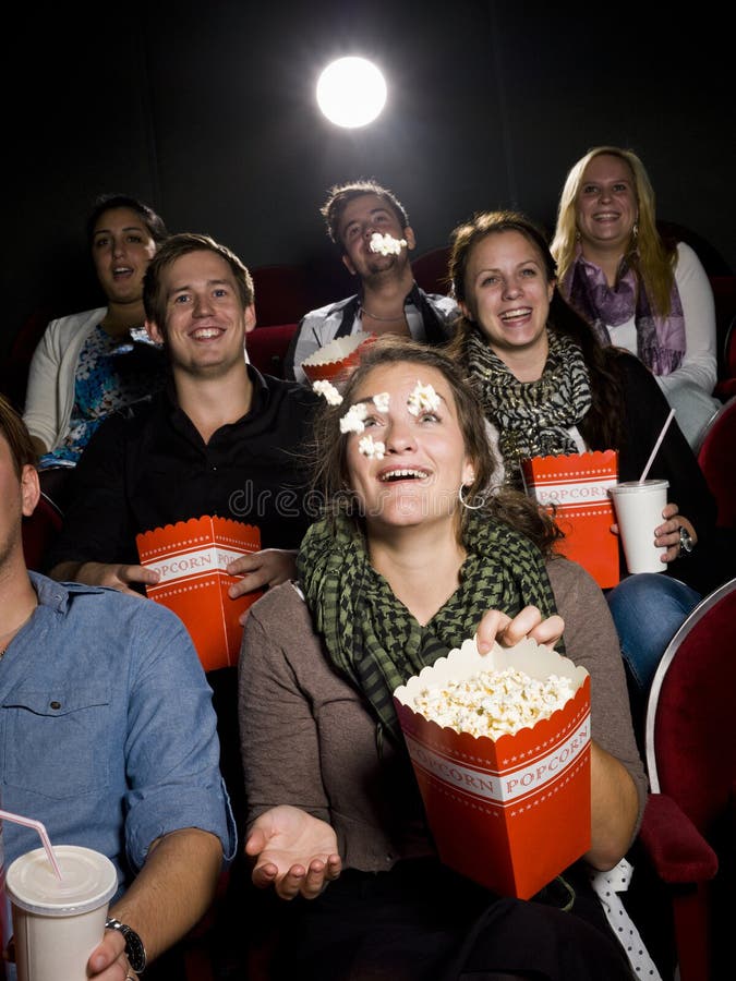 People eating popcorn stock photo. Image of popcorn, large - 21373970