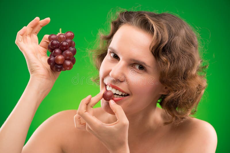Eating red grape stock photo. Image of feminine, attractive - 43733708