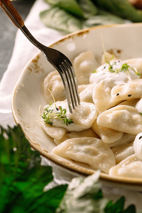 Eating Russian Dumplings Vareniki with Fork Stock Image - Image of ...