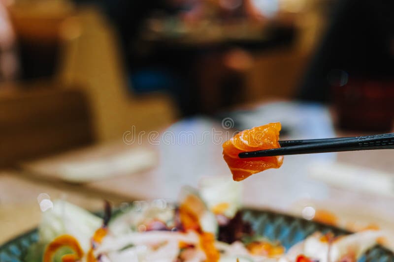 Eating Salmon Sashimi stock photo. Image of plate, tuna - 290666728