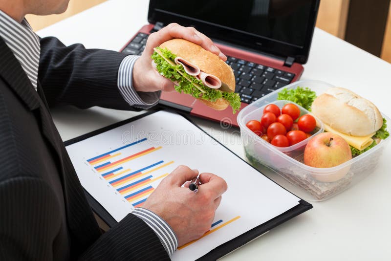 Eating Sandwich during the Work Stock Photo - Image of food, lunch ...