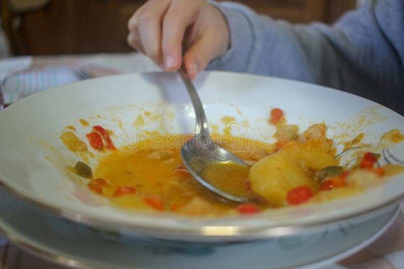 Eating with a Spoon a Healthy Dish of Cod with Chickpeas Stock Photo ...