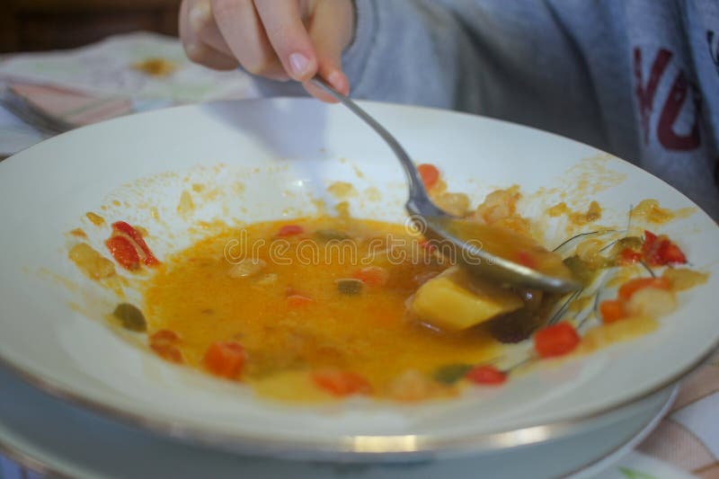 Eating with a Spoon a Healthy Dish of Cod with Chickpeas Stock Image ...