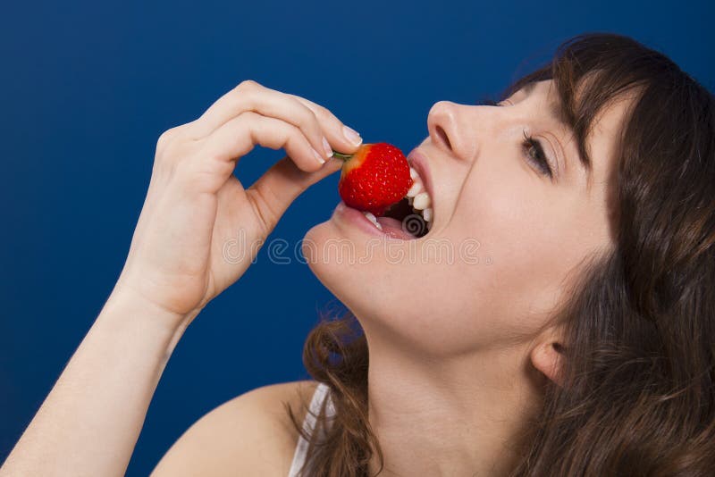 Eating strawberries stock photo. Image of cheerful, gorgeous - 18764474