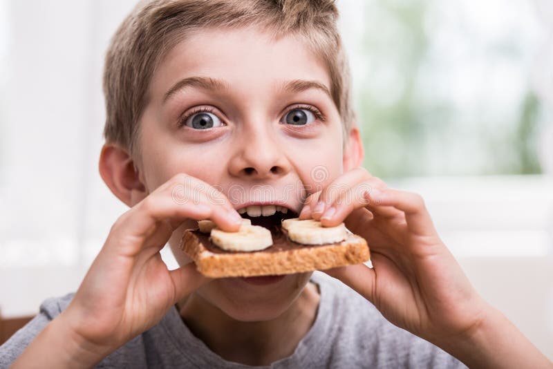 891 Boy Eating Toast Stock Photos - Free & Royalty-Free Stock Photos ...
