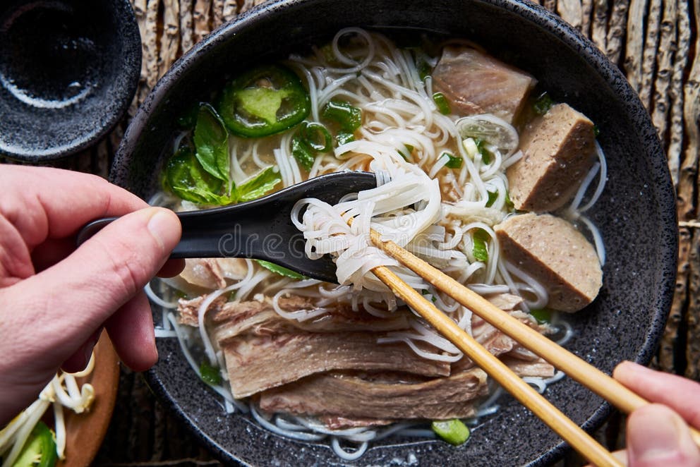 Eating Vietnamese Pho with Chopsticks and Spoon Stock Image - Image of ...