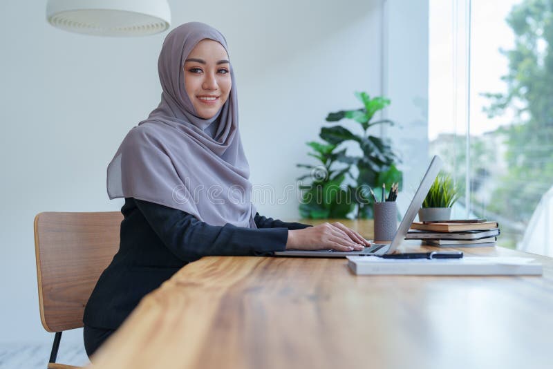 Eautiful Muslim Woman Using Computer and Documents Working in Office ...