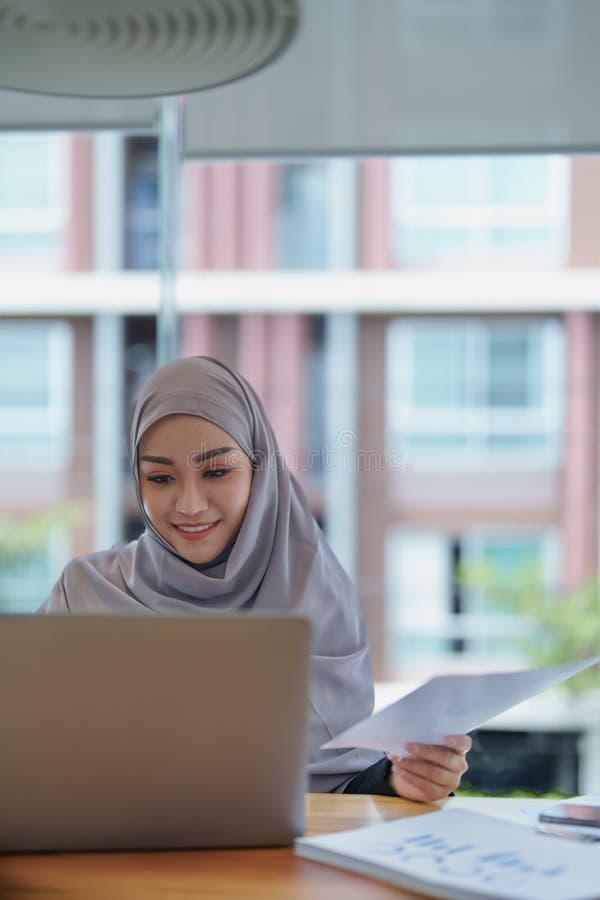 Eautiful Muslim Woman Using Computer and Documents Working in Office ...