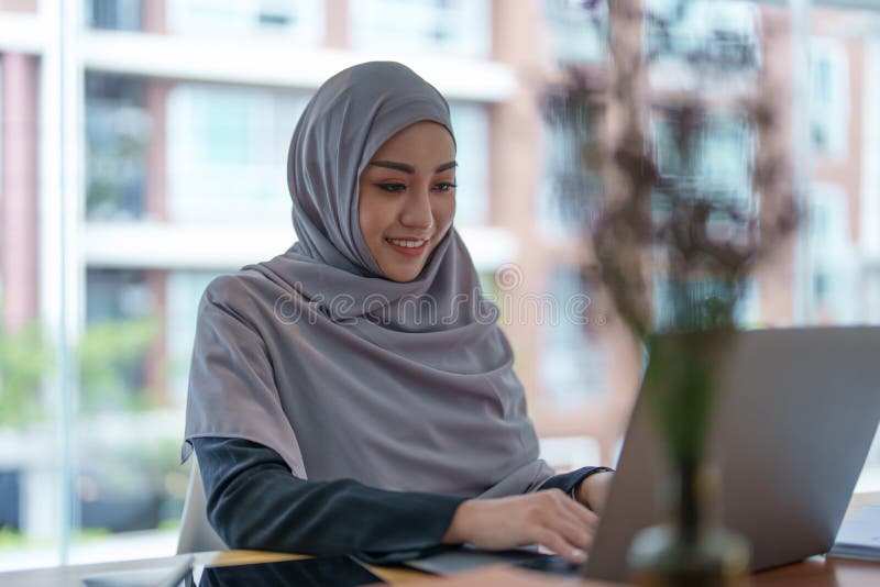Eautiful Muslim Woman Using Computer and Documents Working in Office ...