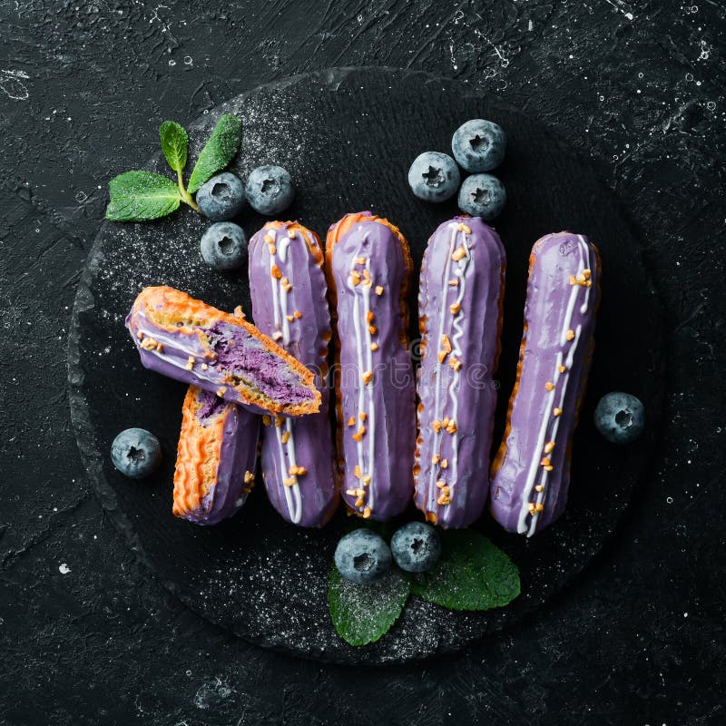 Eclair with Blueberry Cream. Blueberry Dessert on a Black Stone Plate ...