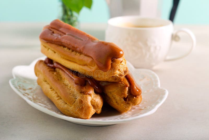 Eclair Cakes with Caramel Glaze Stock Photo - Image of dessert, caramel ...