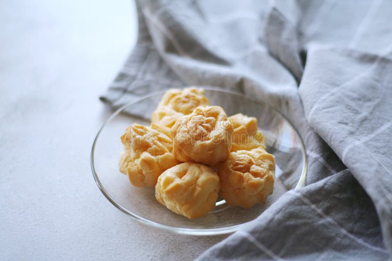 Eclair is Placed in a Glass Dish on a White Table Stock Photo - Image ...