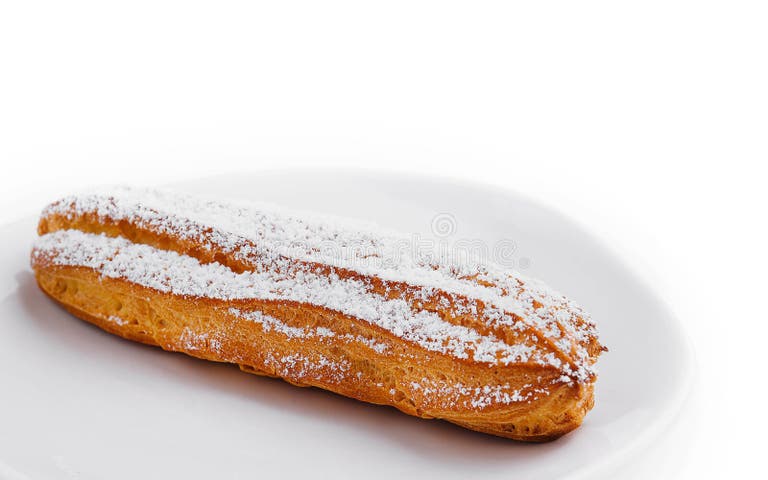 Eclair with Powdered Sugar on a Plate Stock Image - Image of diet ...