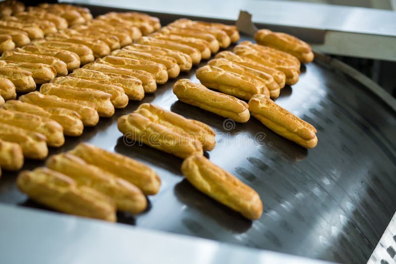 Eclair Shells on Conveyor Belt. Stock Photo - Image of equipment ...
