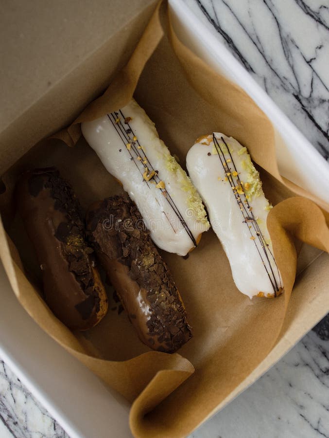 Eclairs in box stock photo. Image of eclair, takeout - 254783546