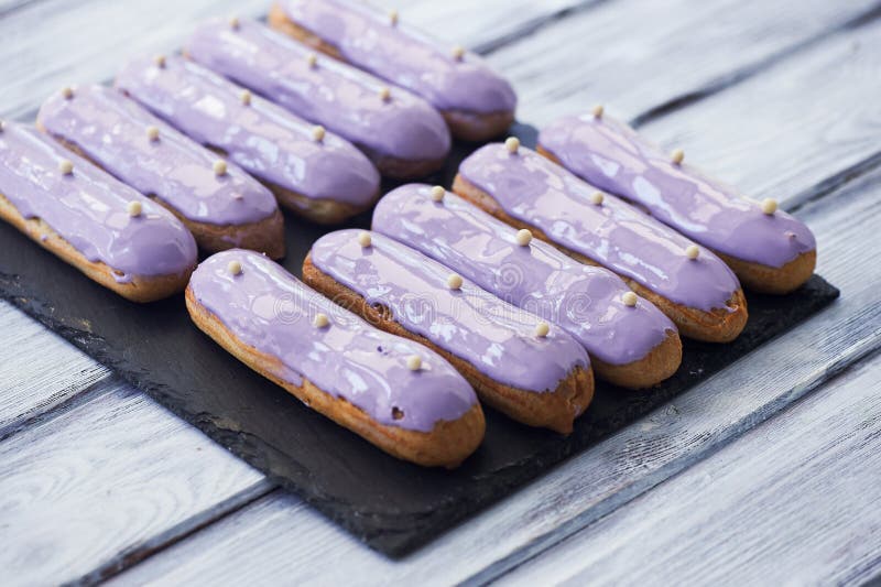 Eclairs, Filled with Purple Frosting. a Work of Culinary Art Stock ...