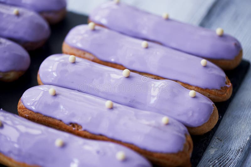 Eclairs, Filled with Purple Frosting. a Work of Culinary Art Stock ...