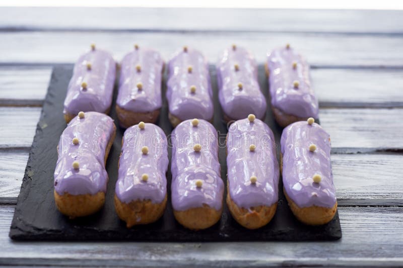 Eclairs, Filled with Purple Frosting. a Work of Culinary Art Stock ...